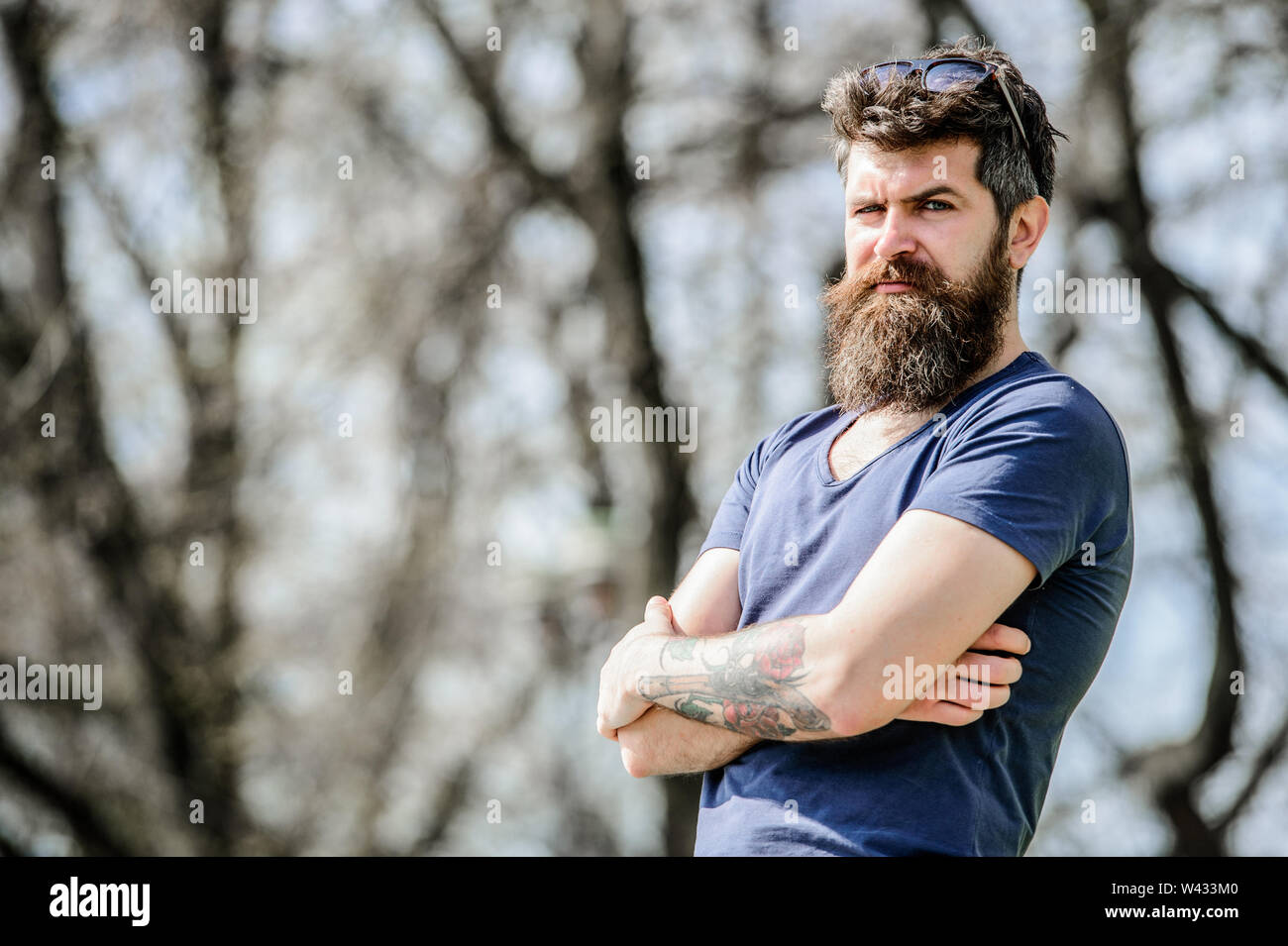 Masculinity and manliness. Man attractive bearded hipster posing ...