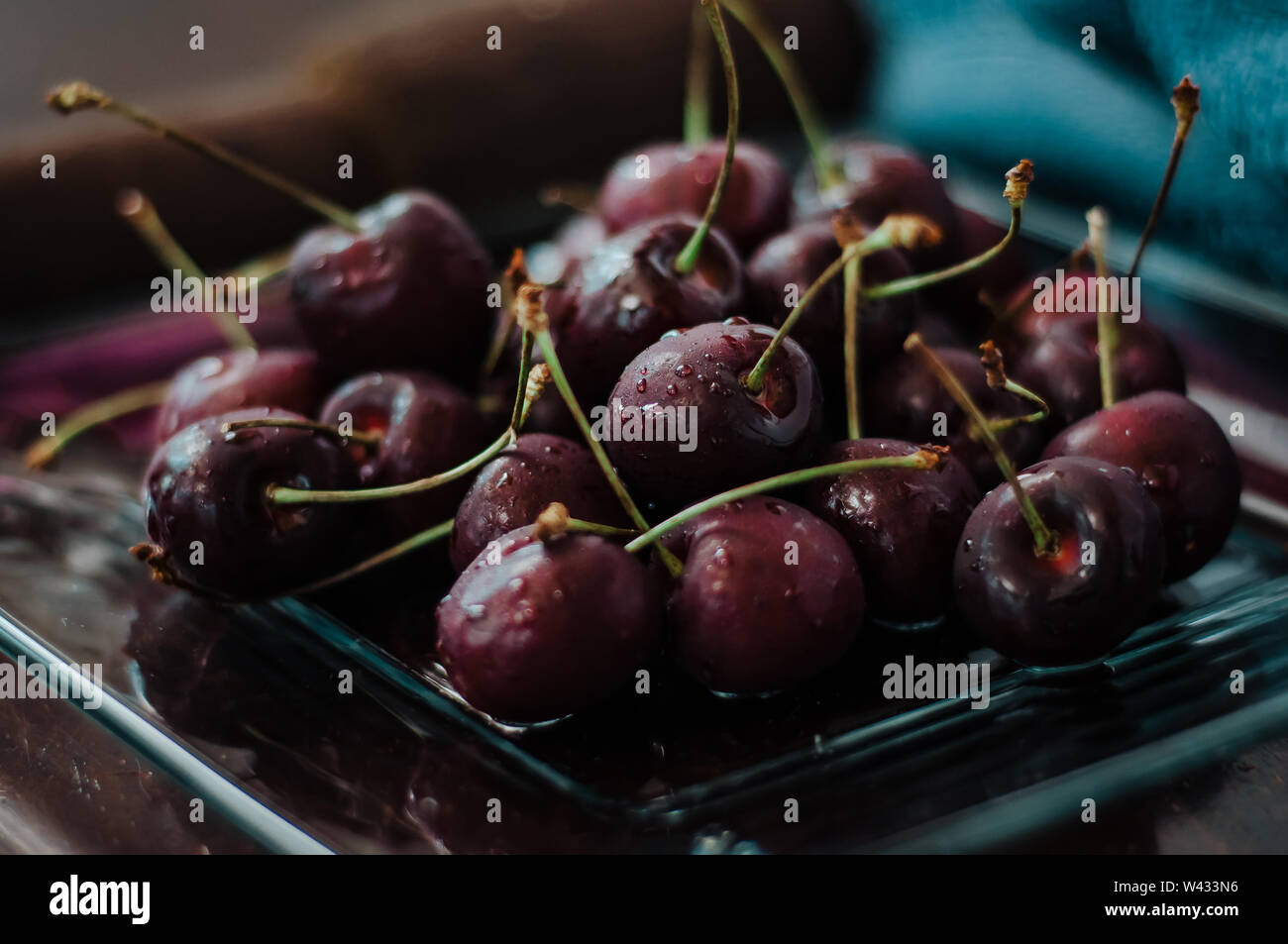 Fresh cherry on clear plate on wooden background. fresh ripe cherries ...