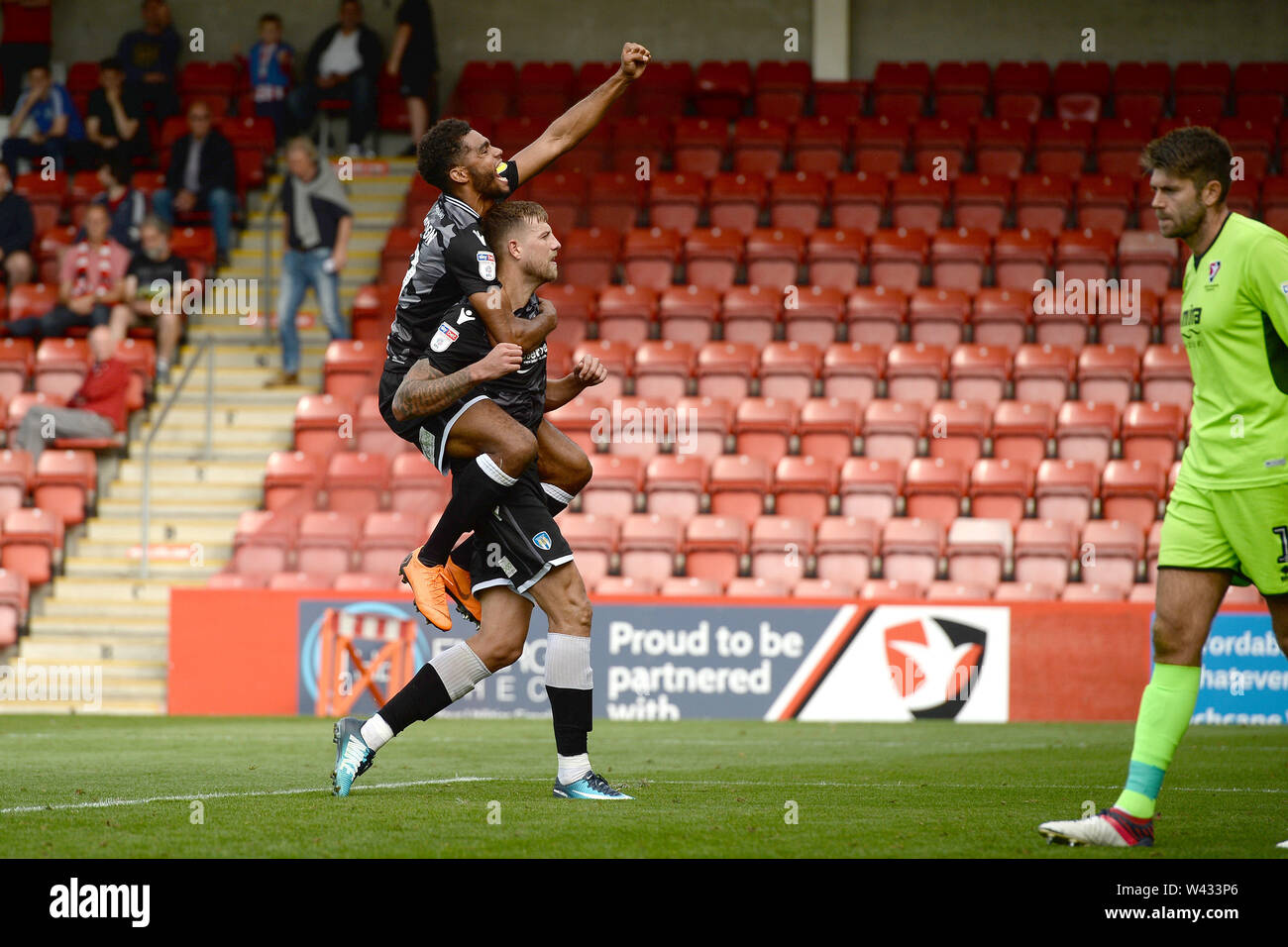 Harry Pell of Colchester United celebrates scoring his sides third goal ...