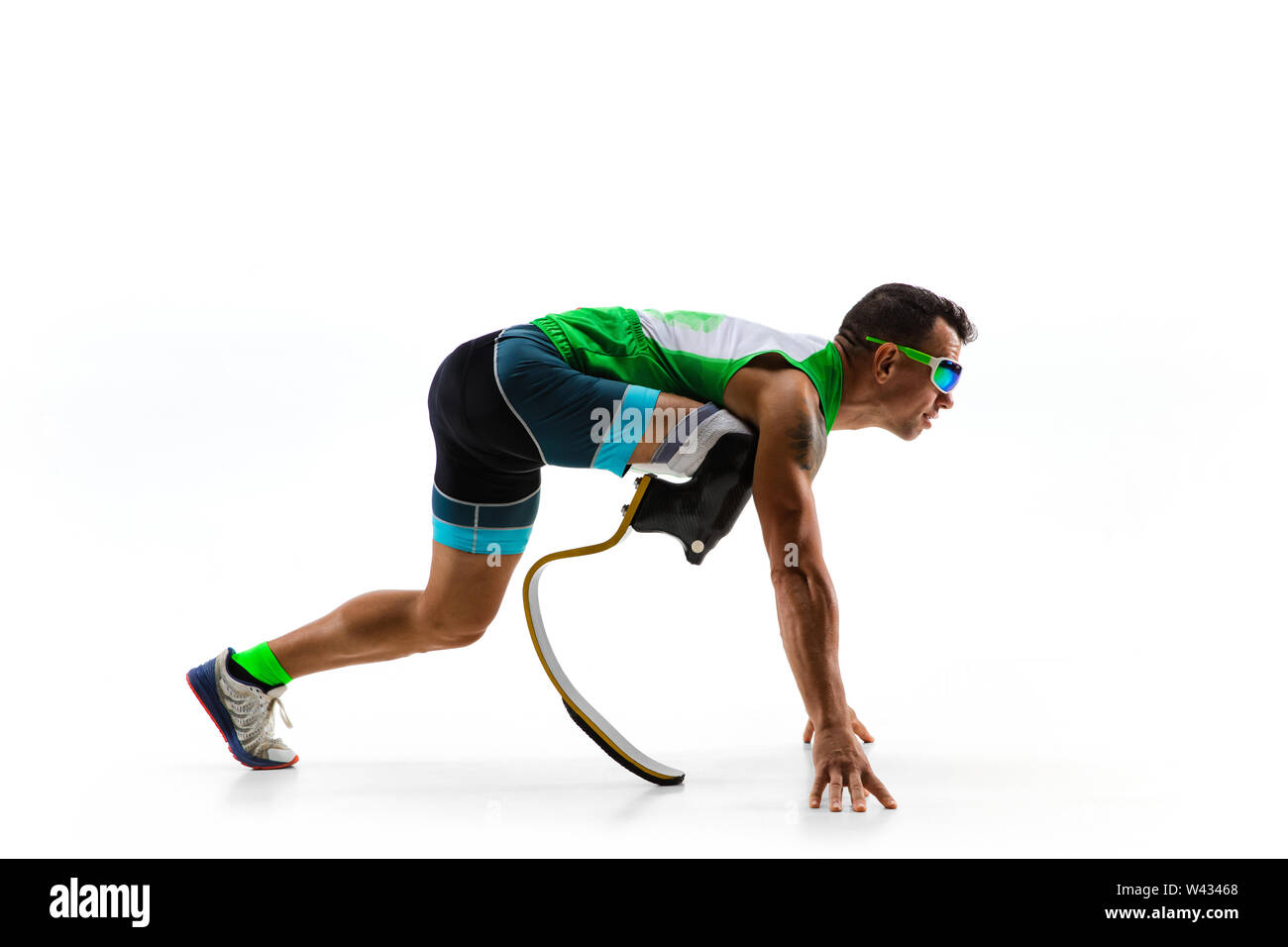 Athlete with disabilities or amputee isolated on white studio ...