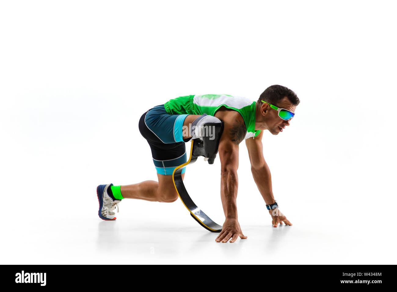 Athlete with disabilities or amputee isolated on white studio ...