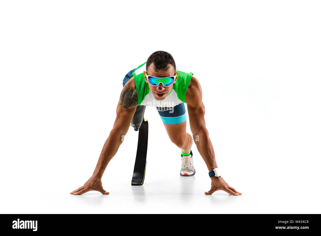 Athlete with disabilities or amputee isolated on white studio ...