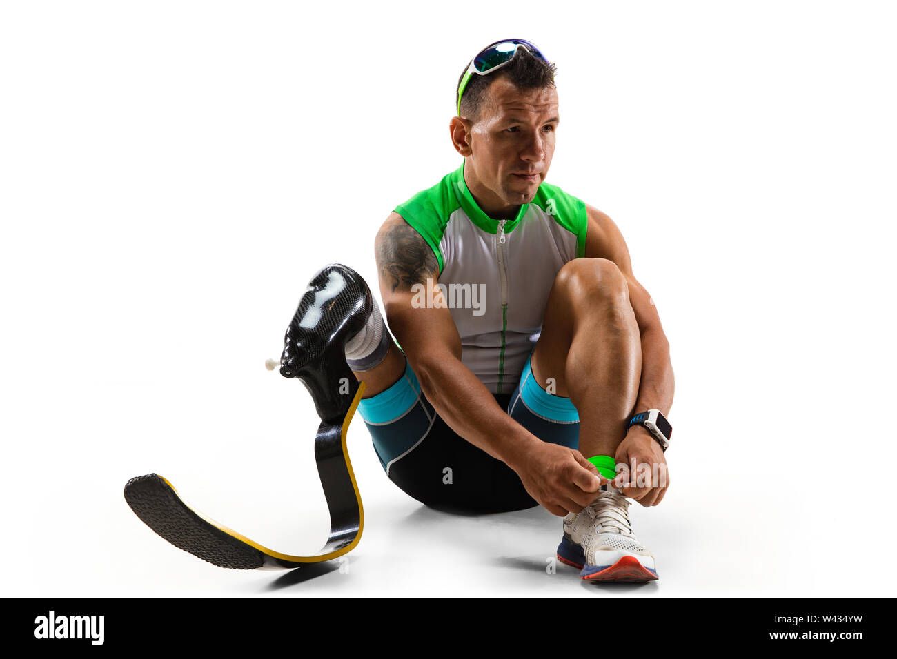 Athlete with disabilities or amputee isolated on white studio ...