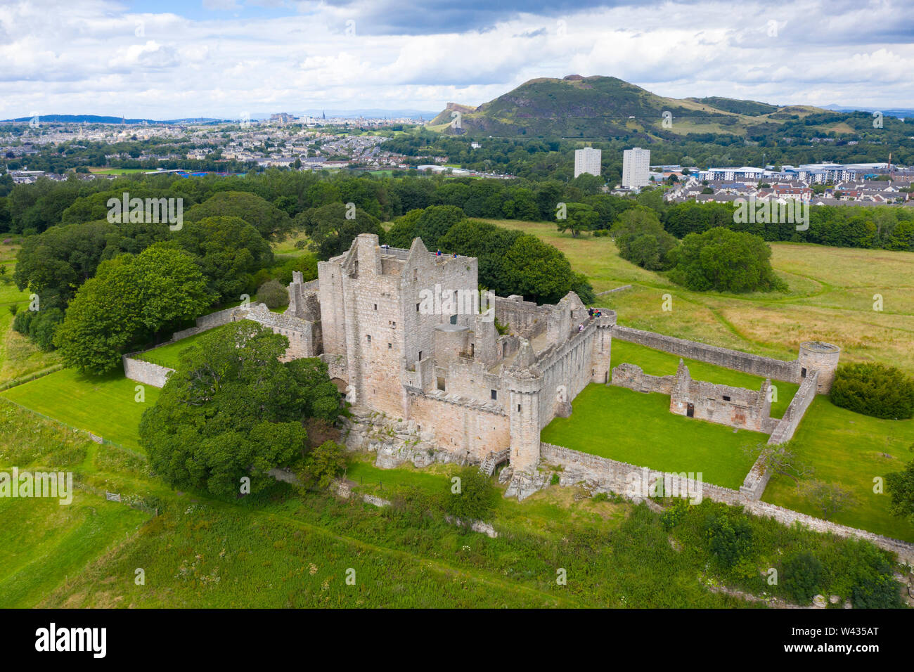 Elevated view of Craigmillar Castle and skyline of Edinburgh, Scotland ...