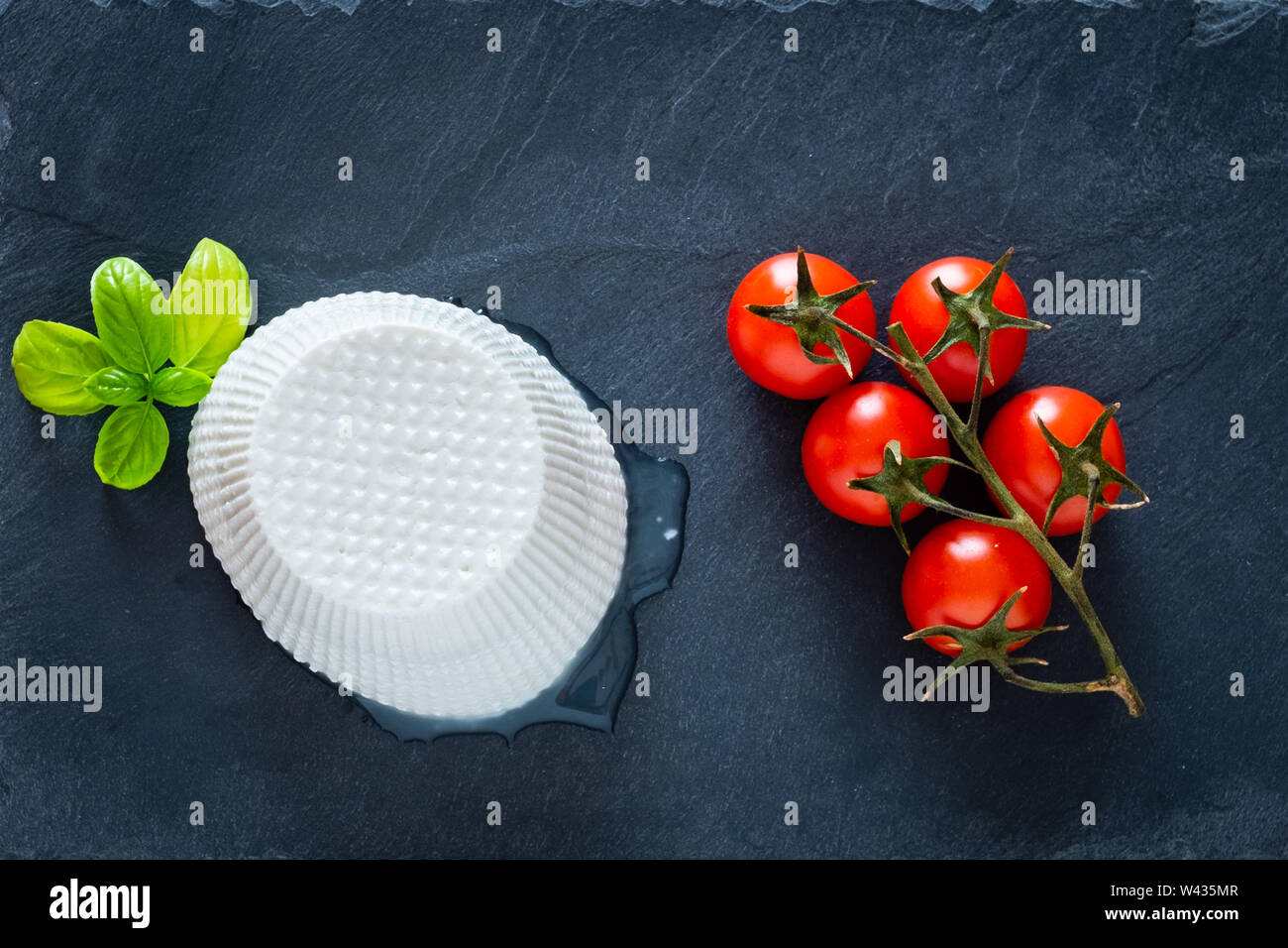 Composition of tomatos, basil and ricotta cheese handmade in Puglia ...