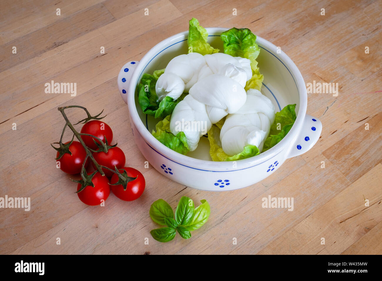 Cow's milk mozzarella cheese handmade in Puglia served in a typical ...