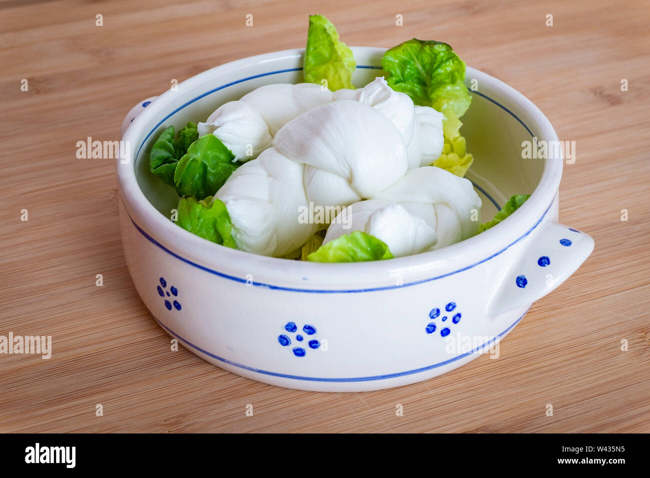 Cow's milk mozzarella cheese handmade in Puglia served in a typical ...