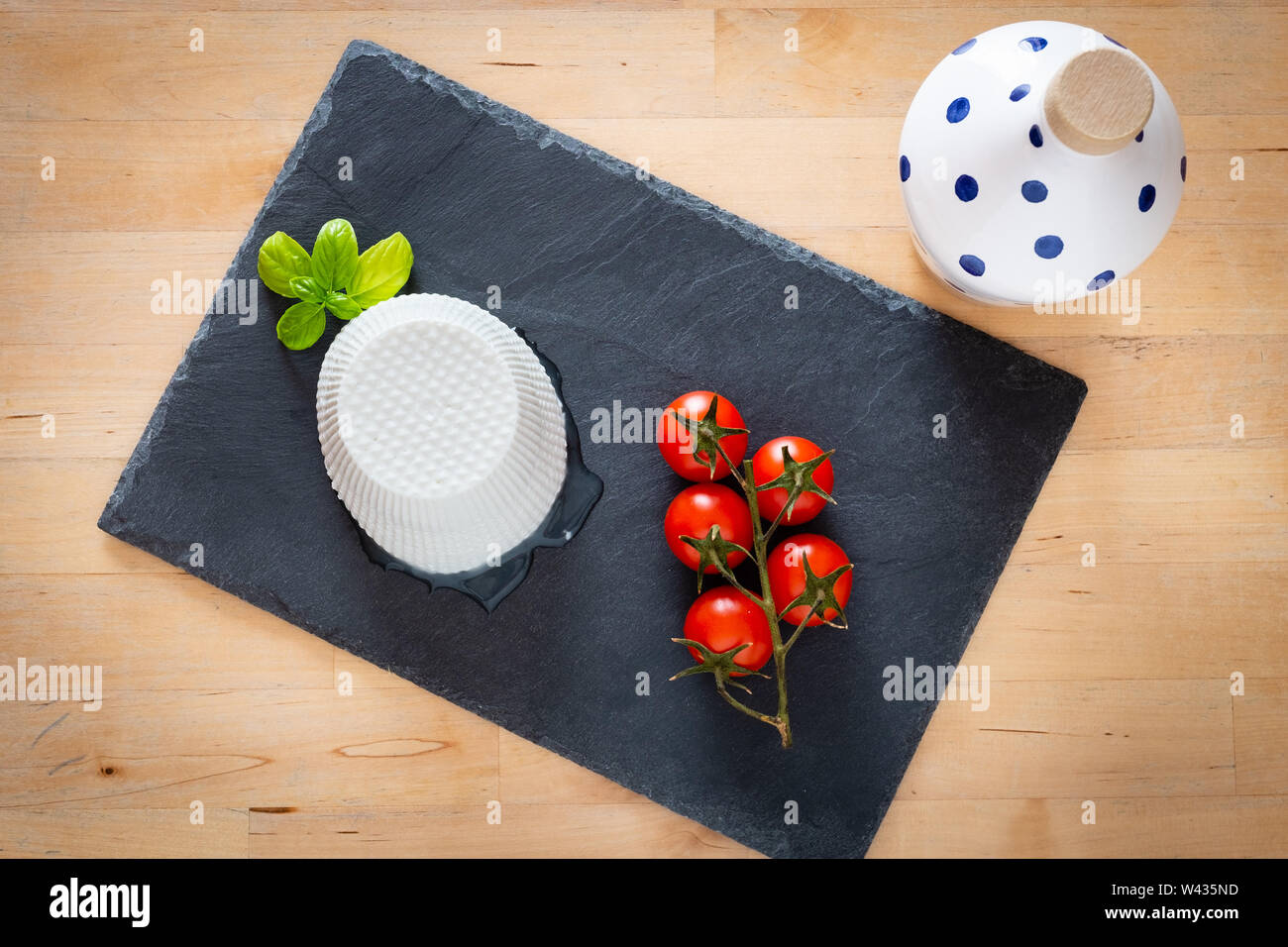 Composition of tomatos, basil and ricotta cheese handmade in Puglia ...