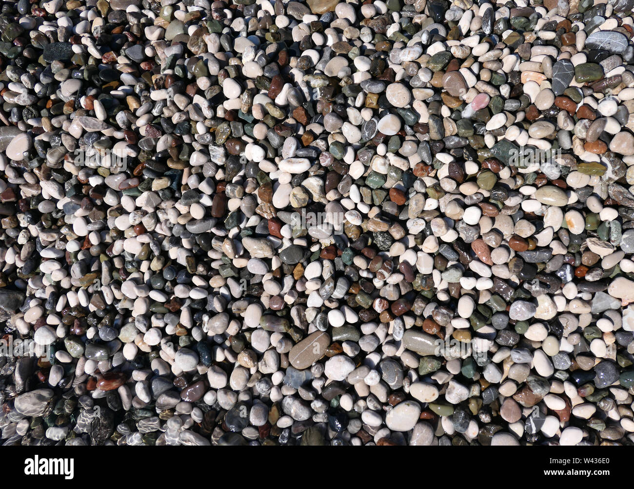 Color pebble as a background Stock Photo - Alamy