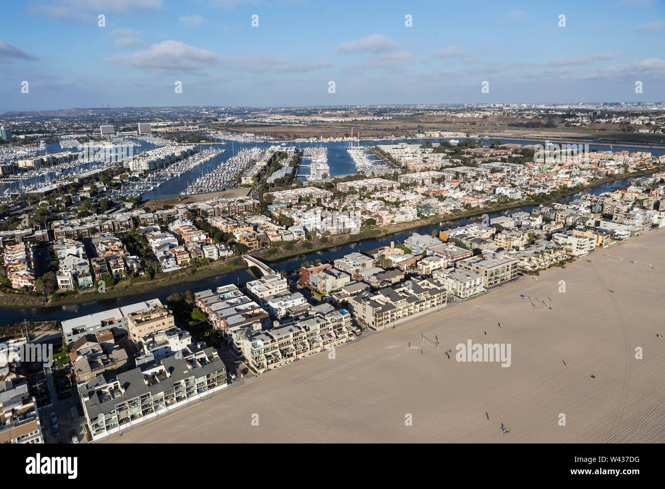 Afternoon aerial view of homes, streets, marina, waterways and Venice ...