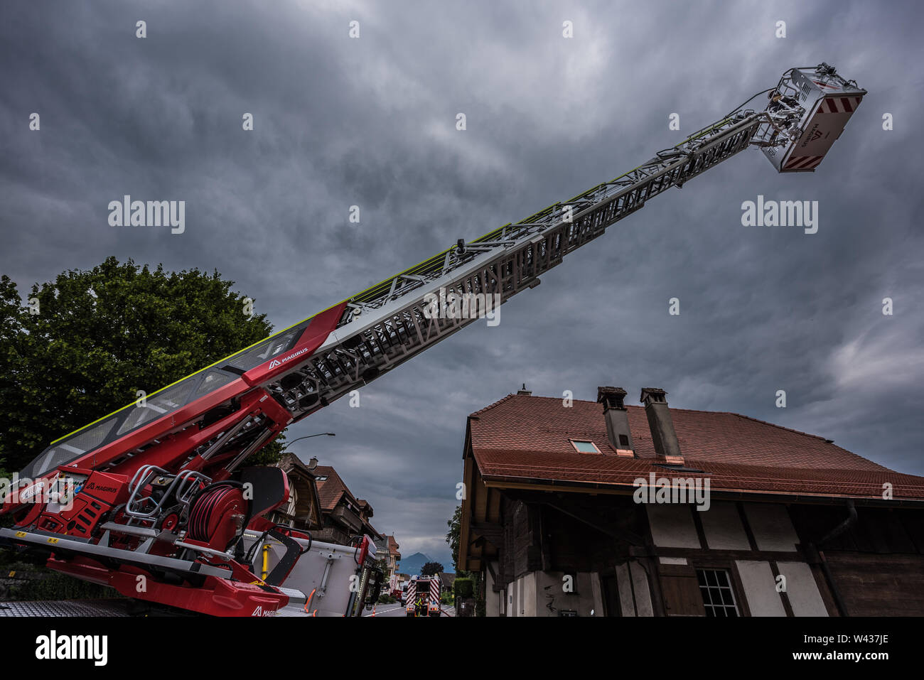 fire engine with turnable ladder with basket Stock Photo - Alamy