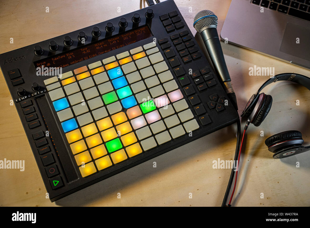 Home music production. An Ableton Push midi pad controller with Macbook, microphone and ...