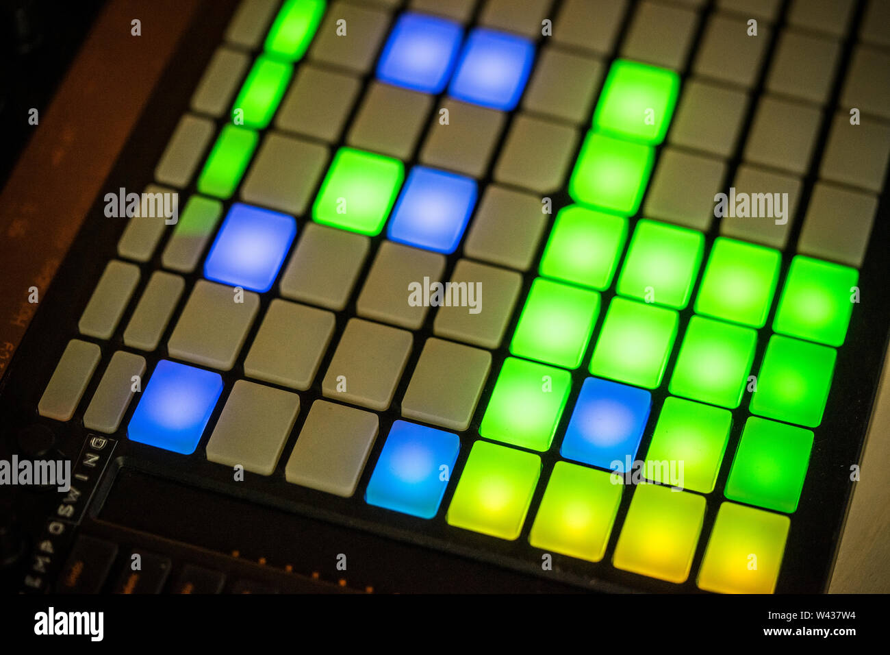 Electronic music production in a home studio. Closeup of coloured LED ...