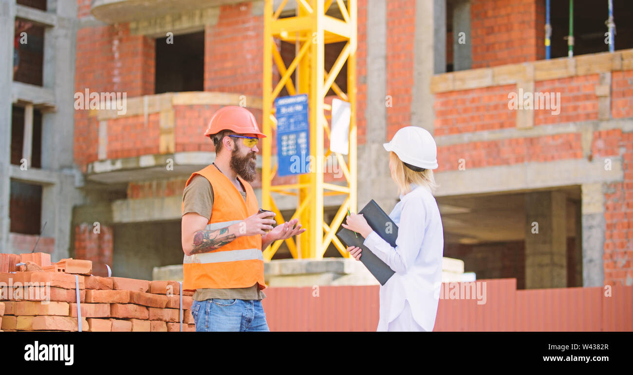 Construction team communication concept. Woman engineer and brutal ...