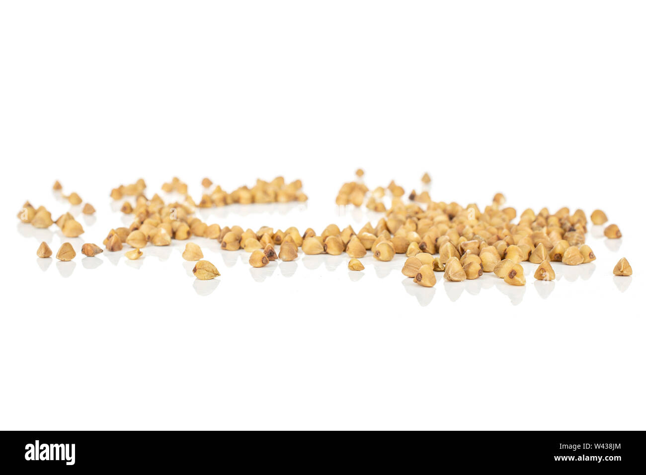 Lot of whole common raw brown buckwheat grain isolated on white ...