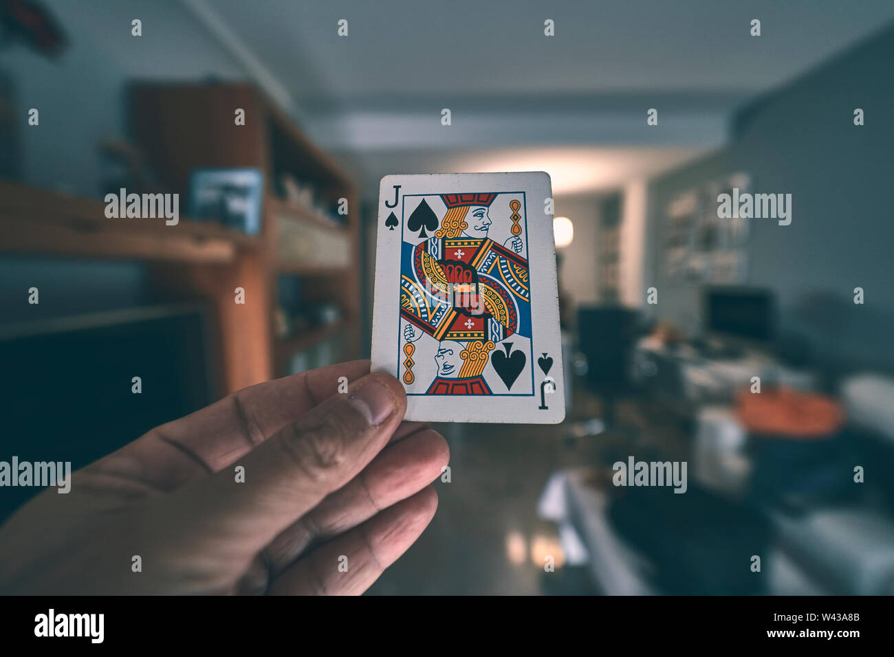 Playing card in a hand Stock Photo - Alamy