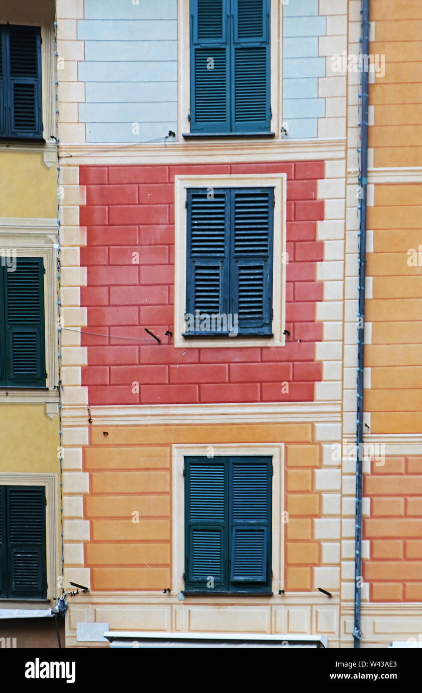 Retro closed windows exterior with blue wooden shades Stock Photo - Alamy