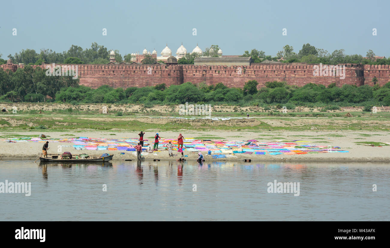 Agra, India - Jul 13, 2015. Washing and drying colorful sarees (Indian ...
