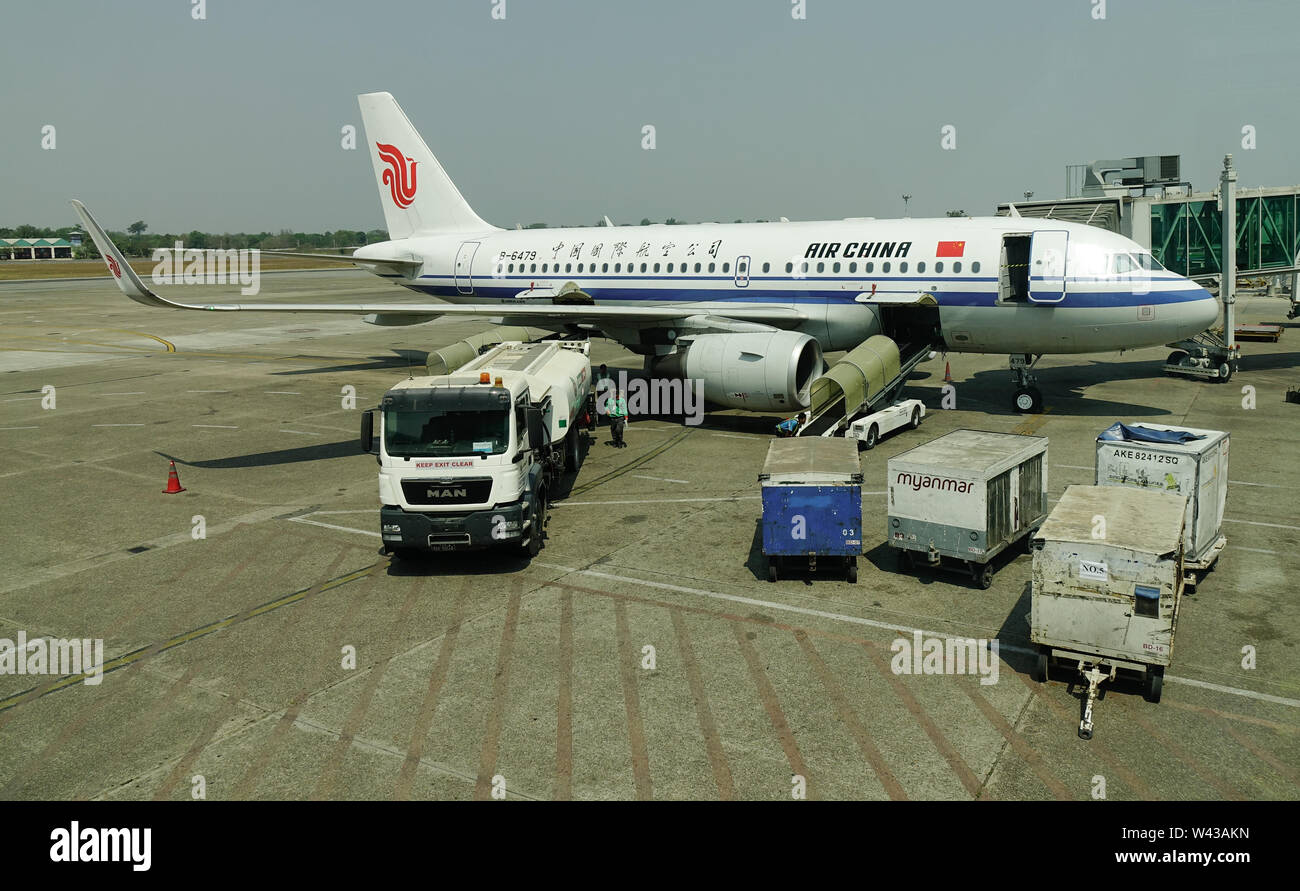 Yangon, Myanmar - Feb 14, 2017. An Air China aircraft docking at the ...