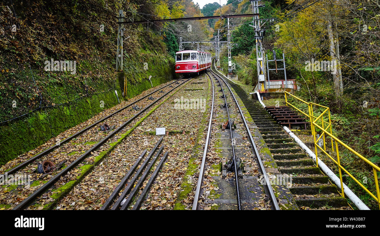 A cable car running on rail track on Mt. Koya (Koyasan) in Japan Stock ...
