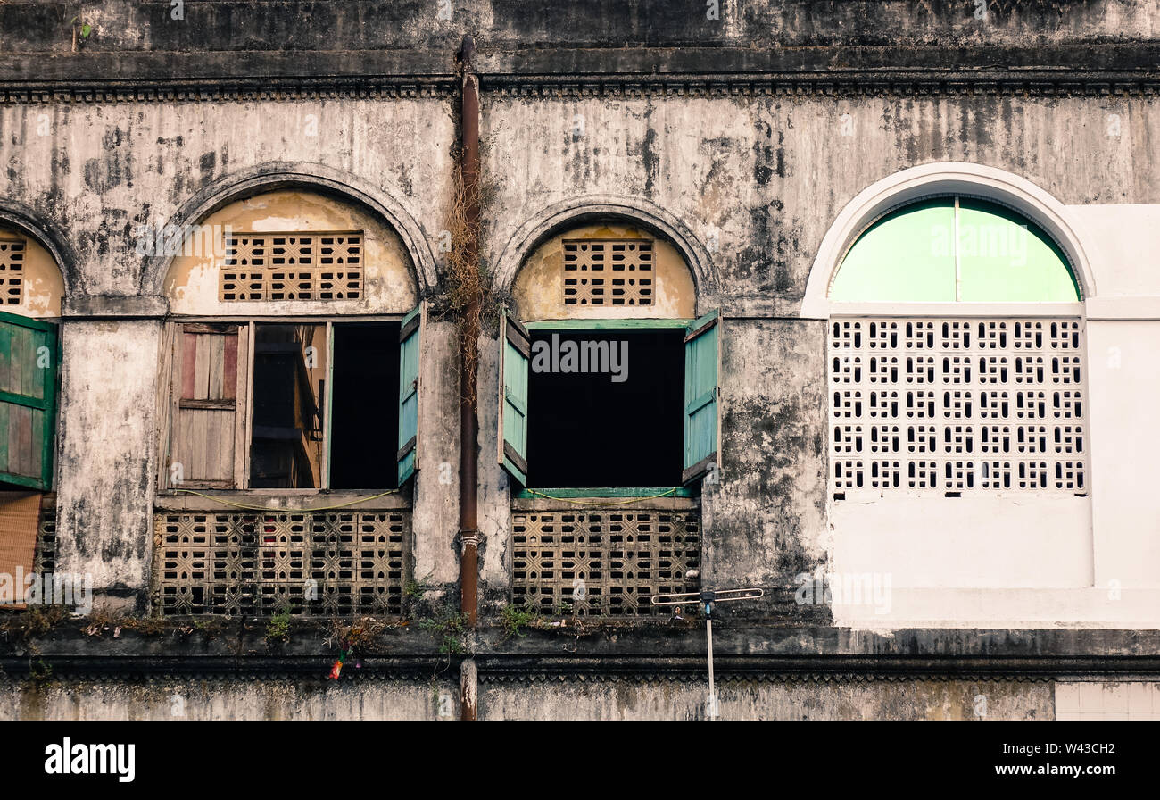 Detail of old apartment with brick doors in Yangon, Myanmar. Yangon has ...