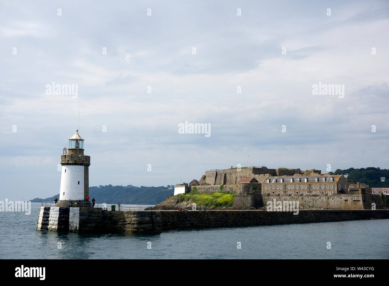 Castle Cornet and the lighthouse of St Peter Port Guernsey Stock Photo ...
