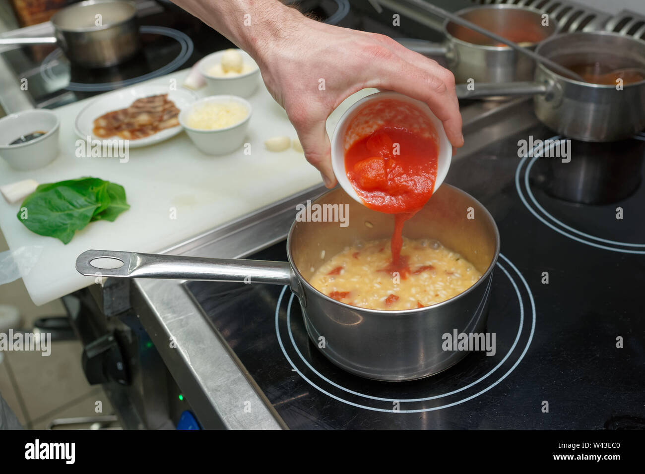 Adding tomatoes hi-res stock photography and images - Alamy