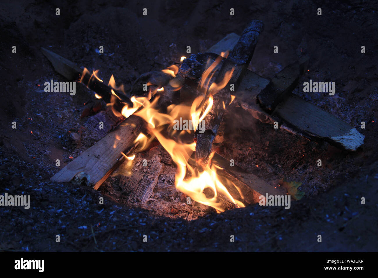 A bonfire in a camping at the night. The overnight stay at summer camp ...