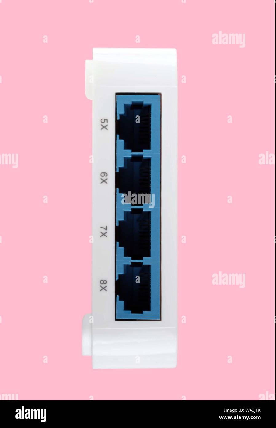 White 8 Port Plastic Ethernet Switch isolated on pink background at dry ...