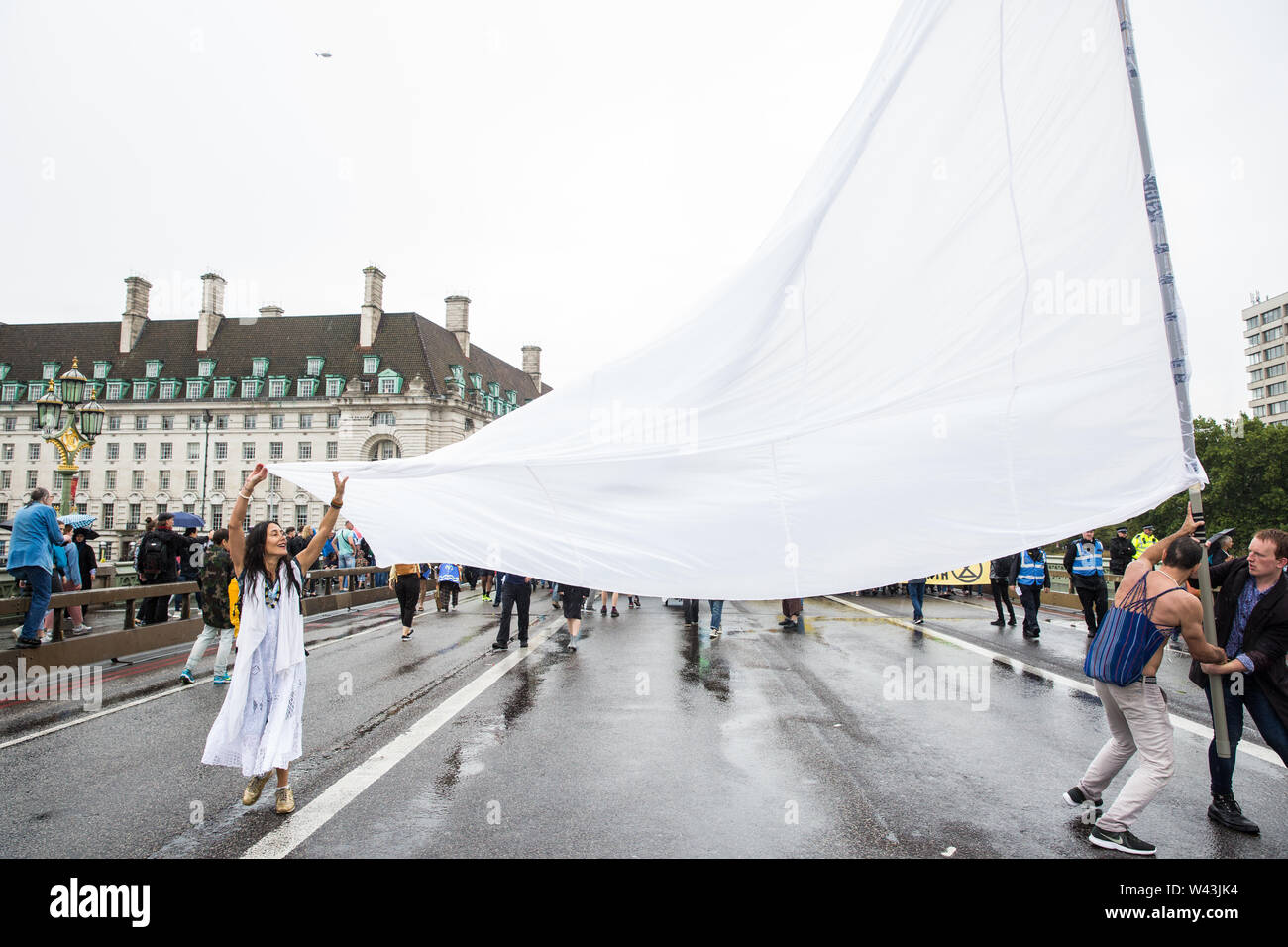 London, UK. 19 July, 2019. Climate activists from Extinction Rebellion ...