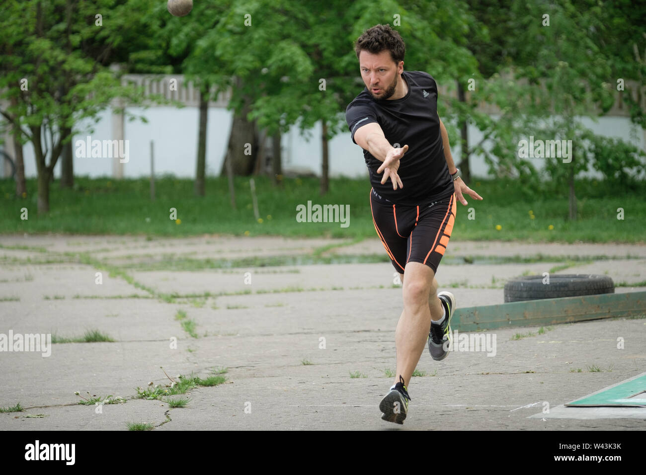 MOSCOW, RUSSIA - MAY 10, 2019: Russian athlete Andrey Domarev throws a ...