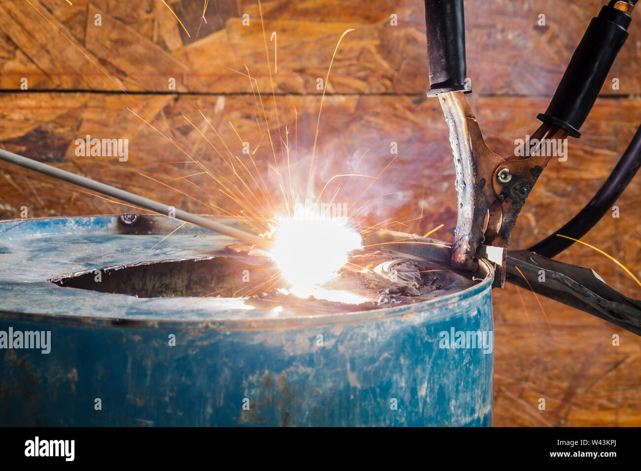 Spark light with welding Process with blue tube metal and bright sparks ...