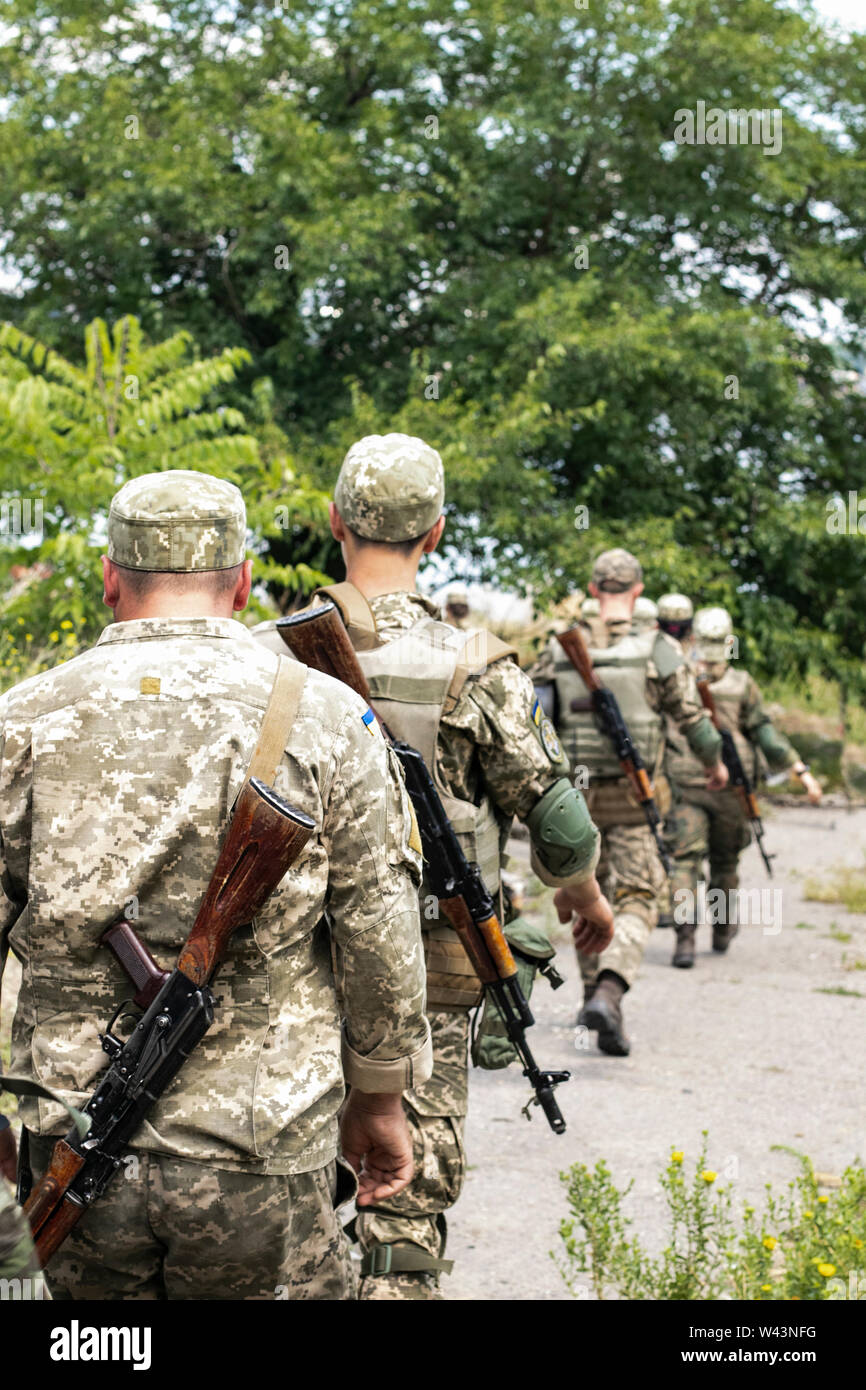 soldiers of the Ukrainian army in uniform with chevrons in full ...