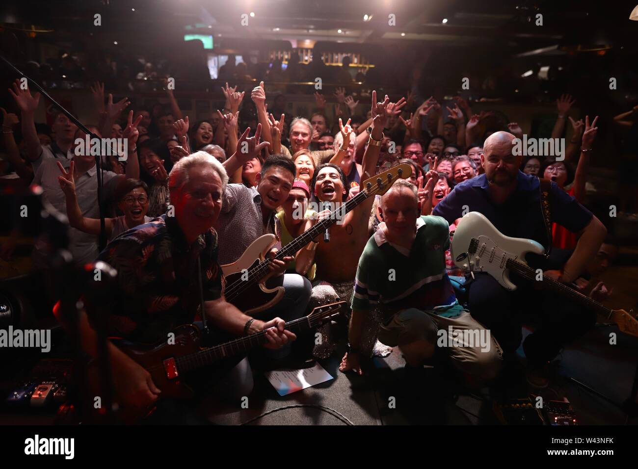 Hong Kong, CHINA. 19th July, 2019. Members of the resident rock band ...