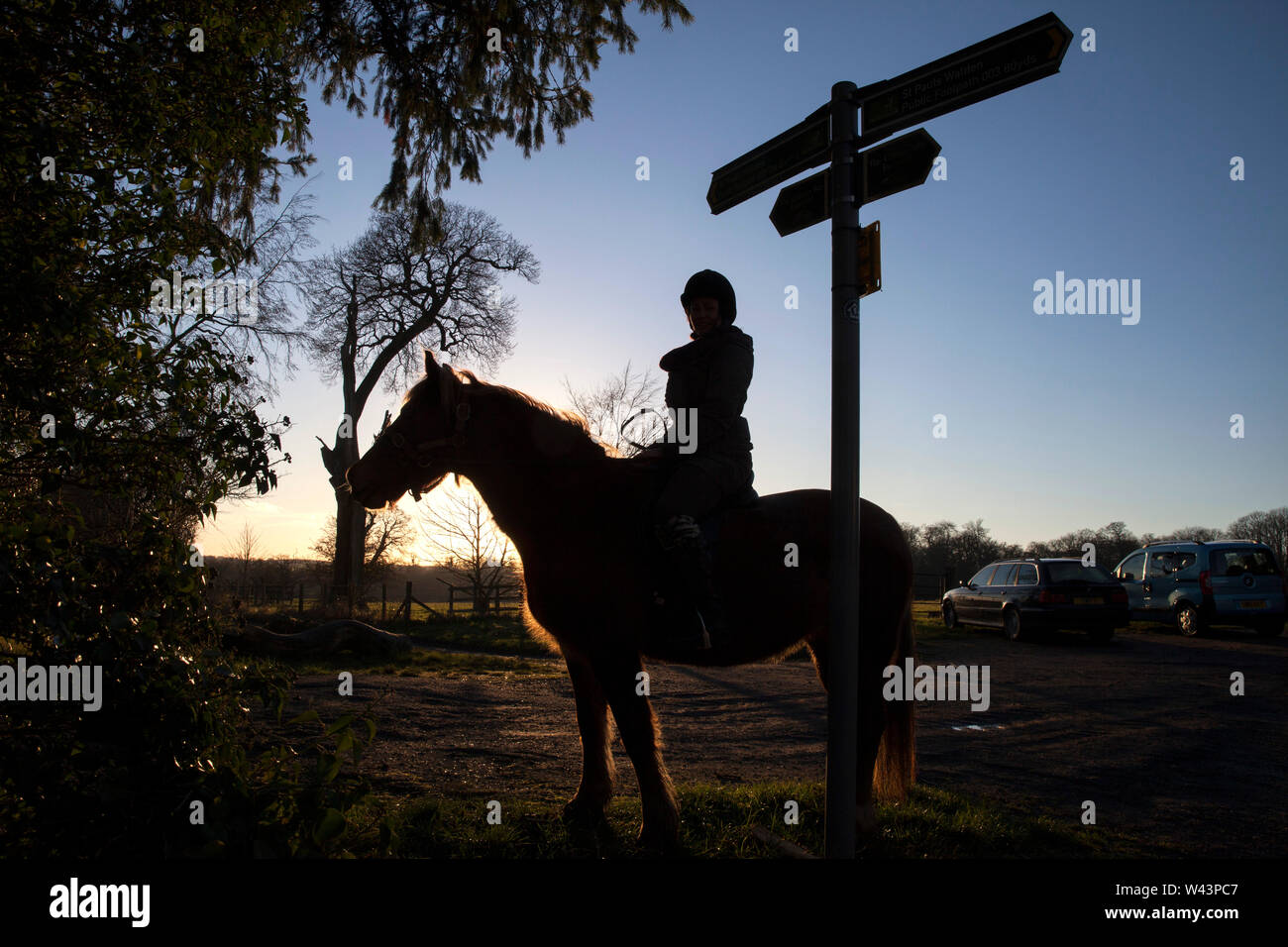 Horse riding in the English countryside lane, St Pauls Warden ...
