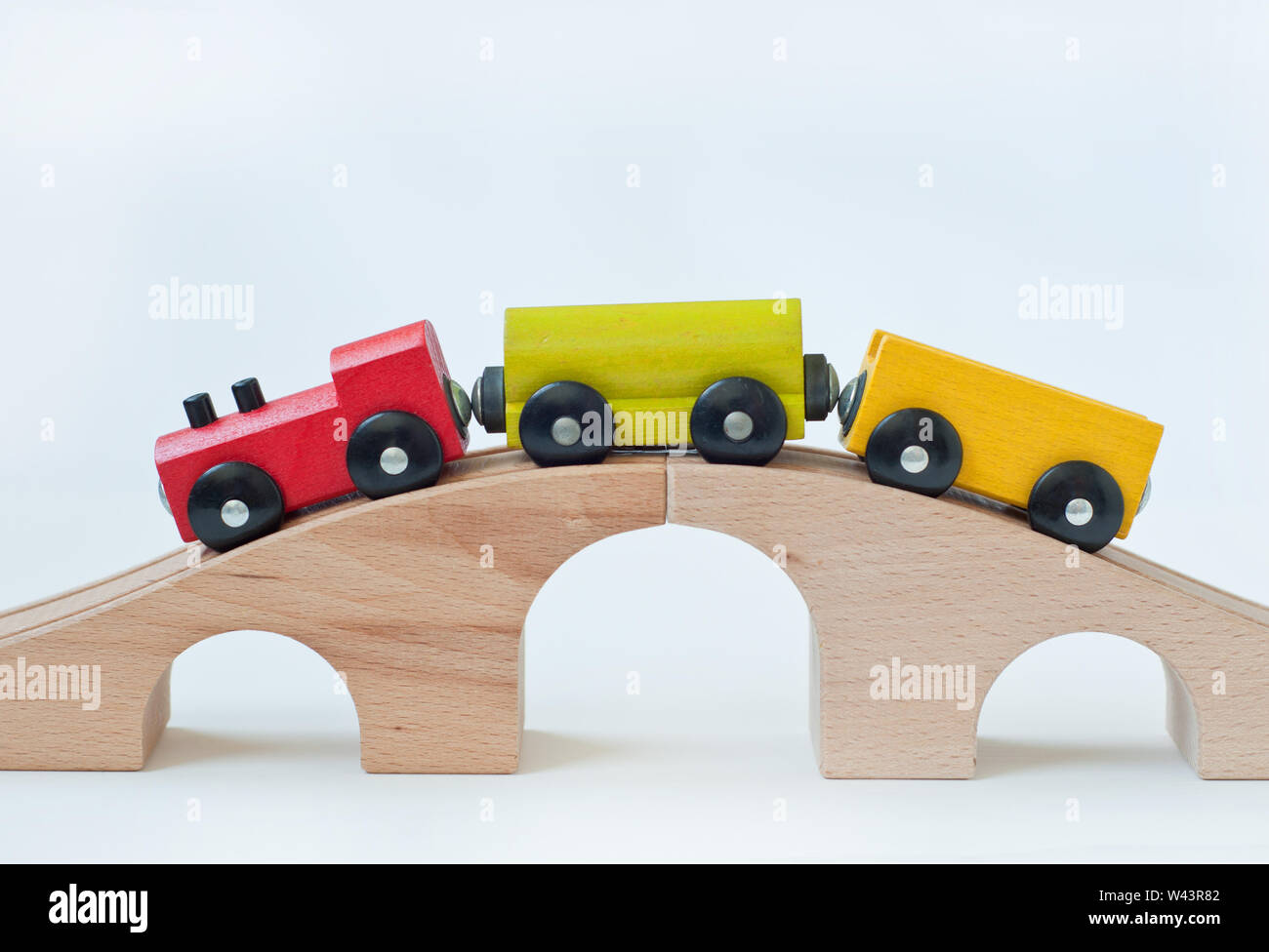 Wooden toy train with colorful blocks. Educational toys Stock Photo - Alamy