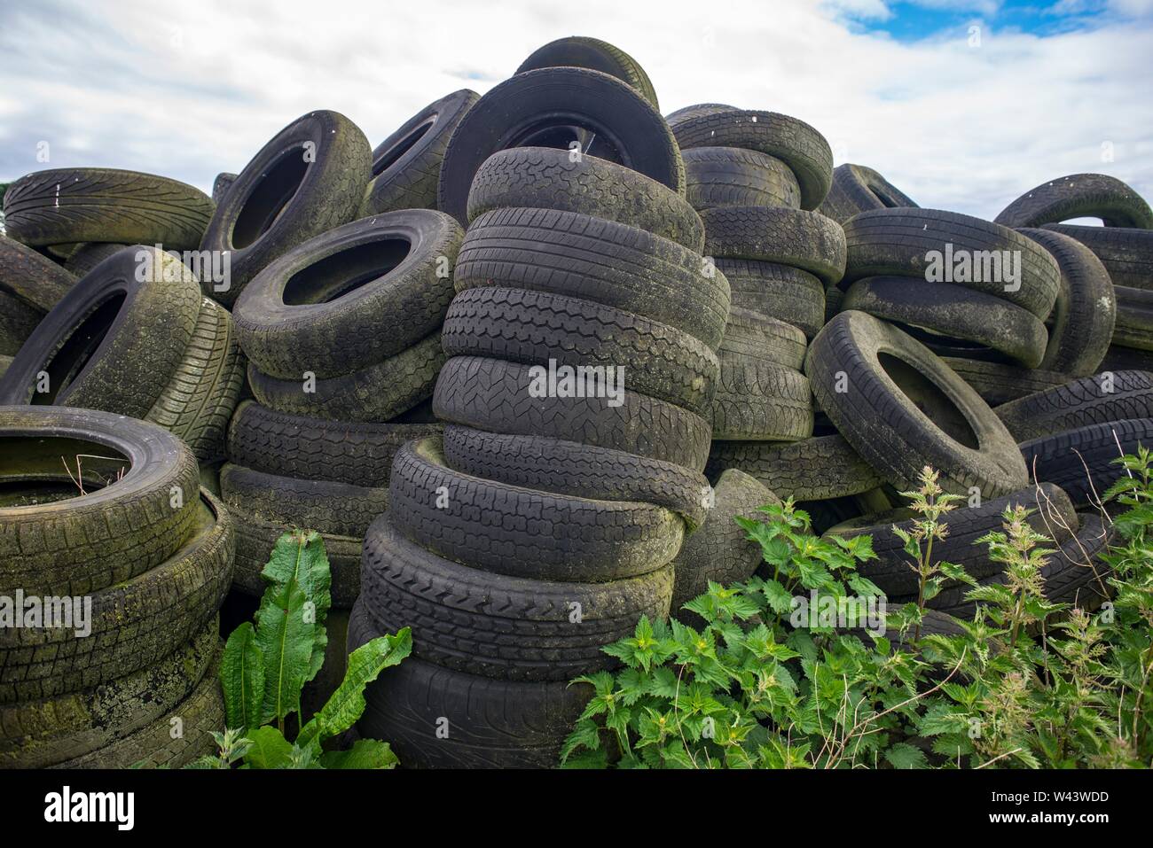 Dumped tyres waste disposal hi-res stock photography and images - Alamy