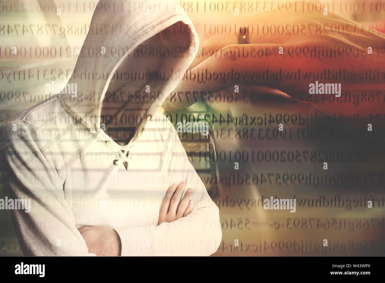 Faceless hooded anonymous computer hacker Stock Photo - Alamy
