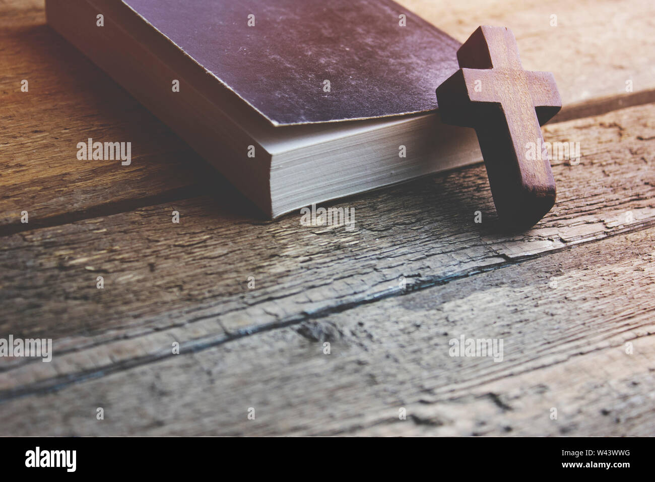 cross on the book background Stock Photo - Alamy