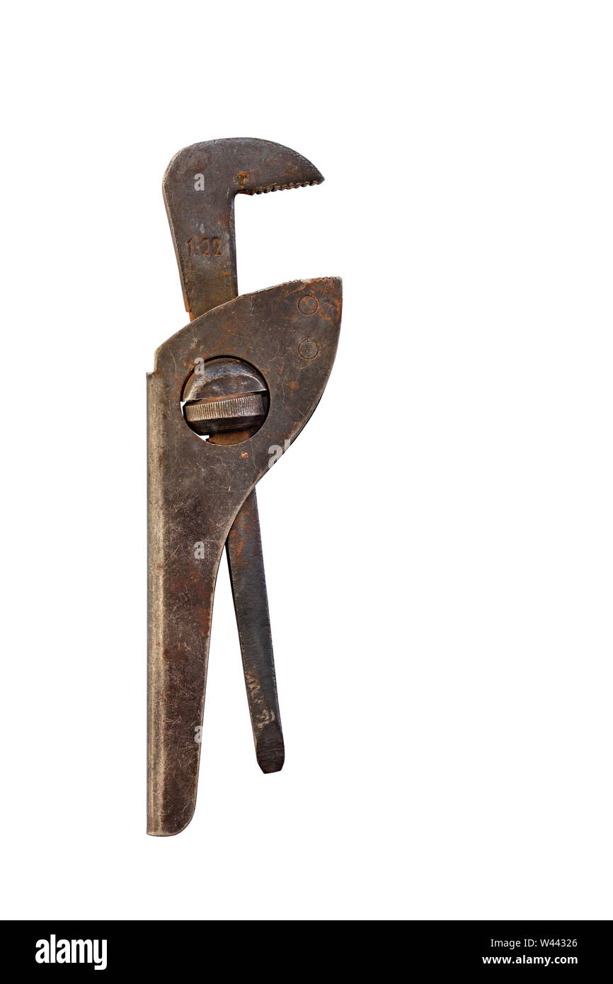 A very old, rusty pipe wrench is located vertically and is isolated on ...