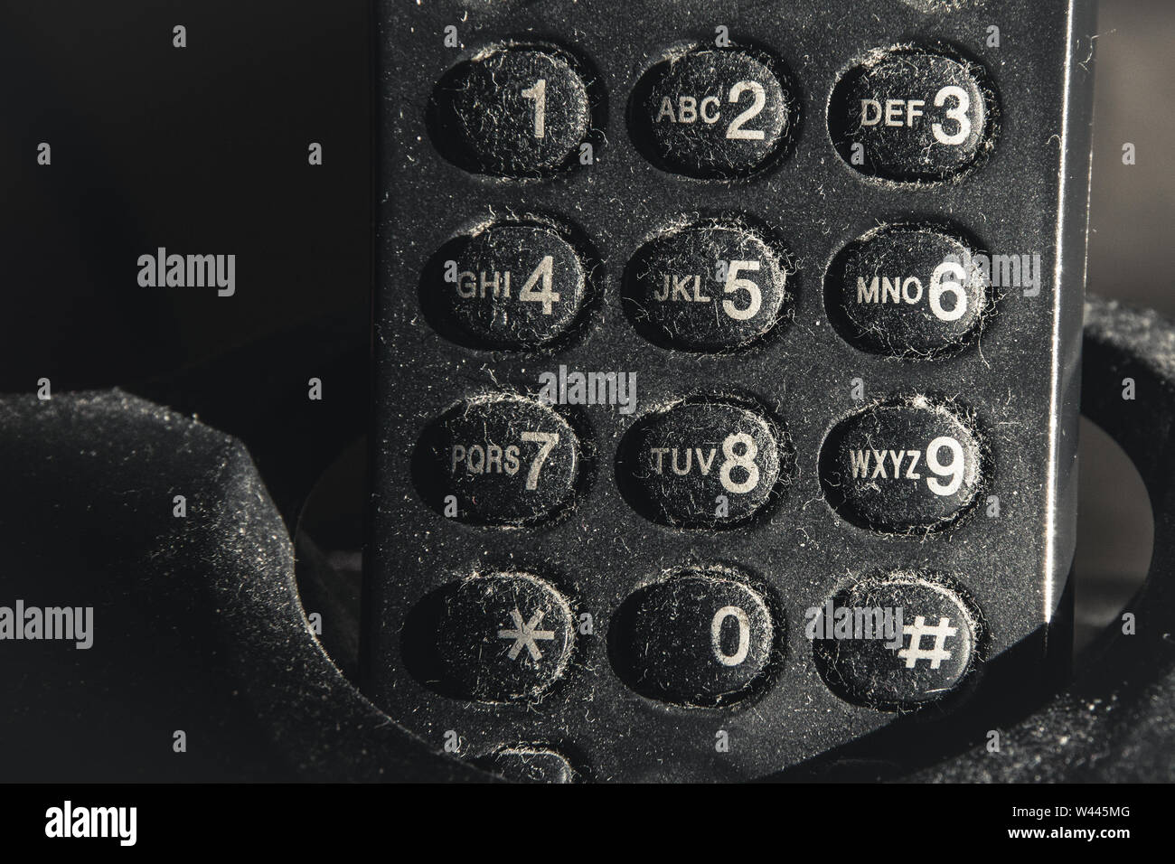 Close up front view of one old black dirty phone. Concept of old ...