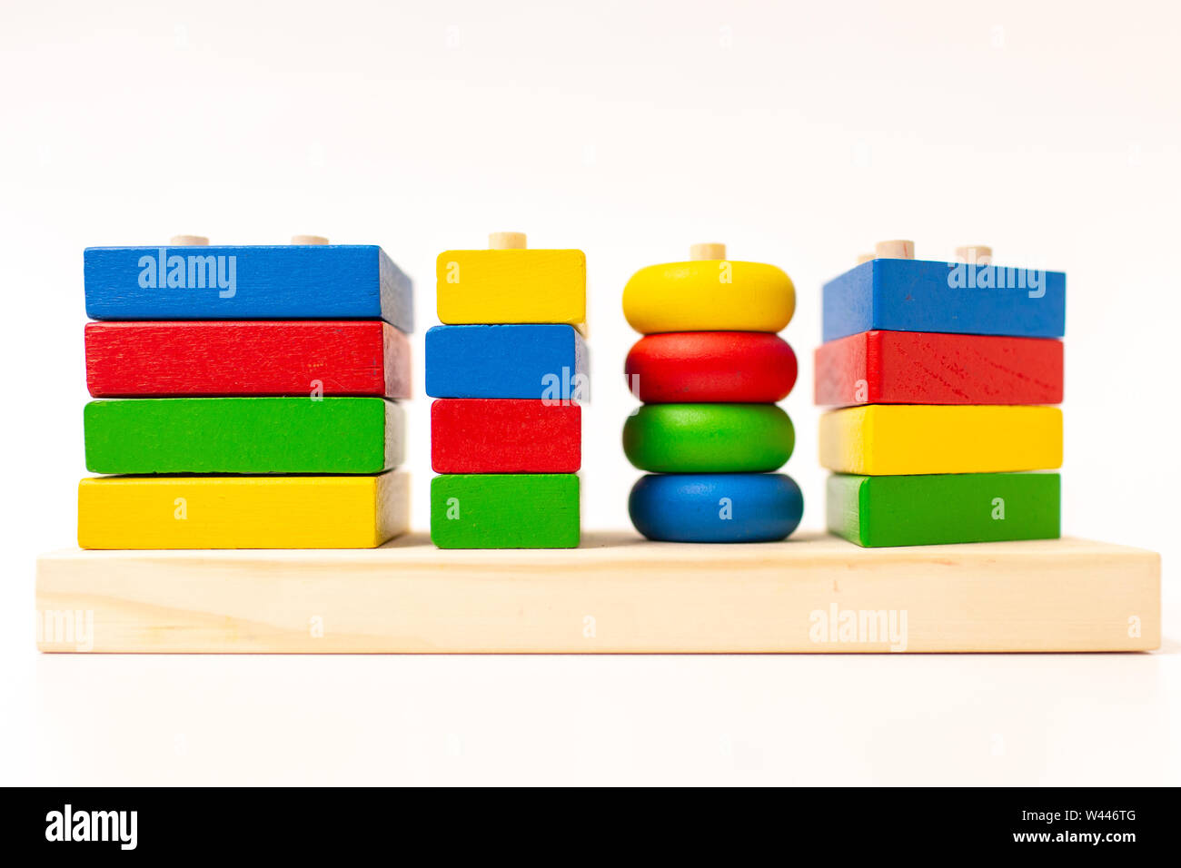 Toy wooden blocks, multicolor building construction bricks over white ...