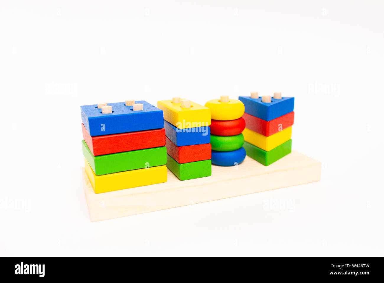 Toy wooden blocks, multicolor building construction bricks over white ...
