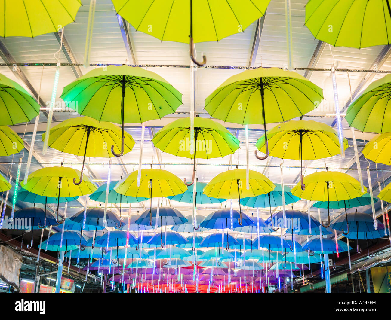 Multiple Colorful Umbrellas Hanging From The Roof Stock Photo - Alamy