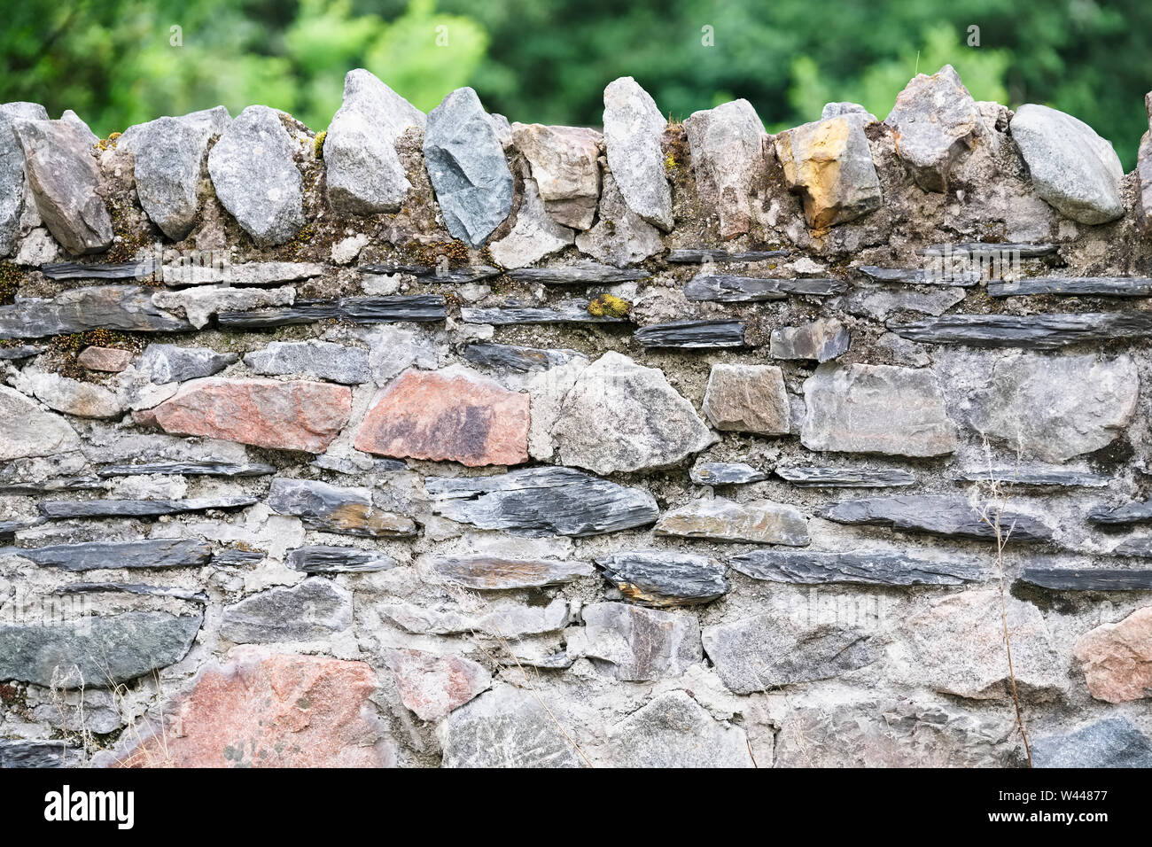 Natural stone and slate traditional wall in the Lake District England ...