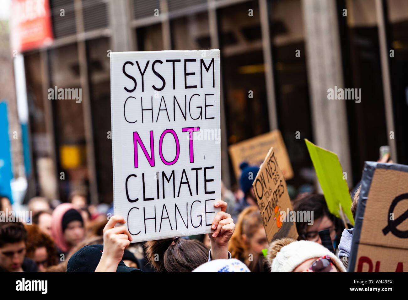 System change not climate change written on a homemade placard during ...