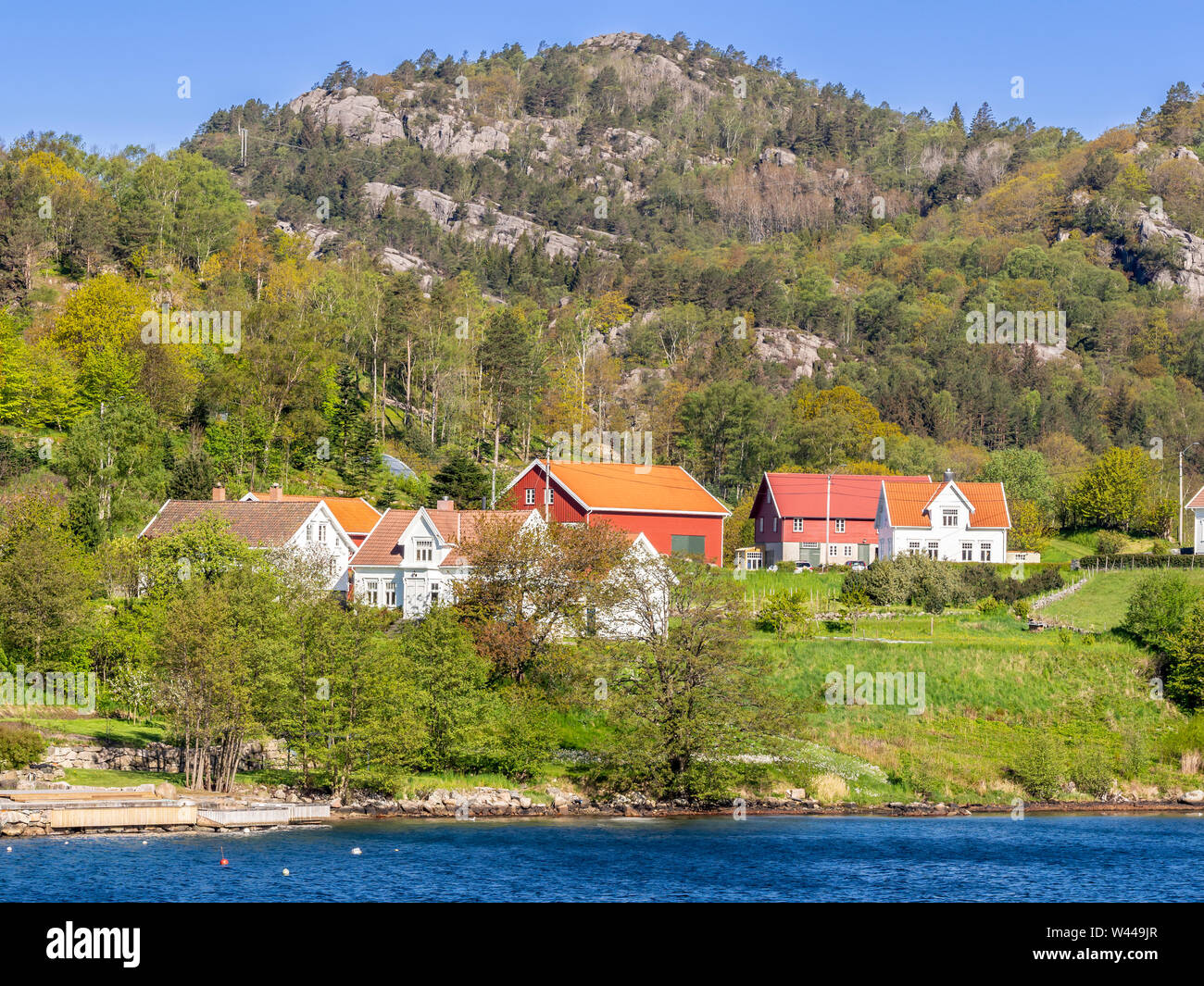 Typical red and white wooden norwegian house, near Cape Lindesnes at ...