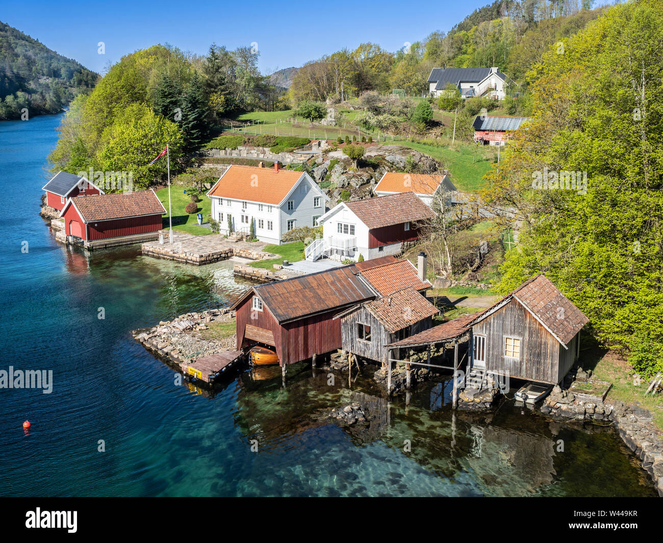 Typical red and white wooden norwegian house, near Cape Lindesnes at ...