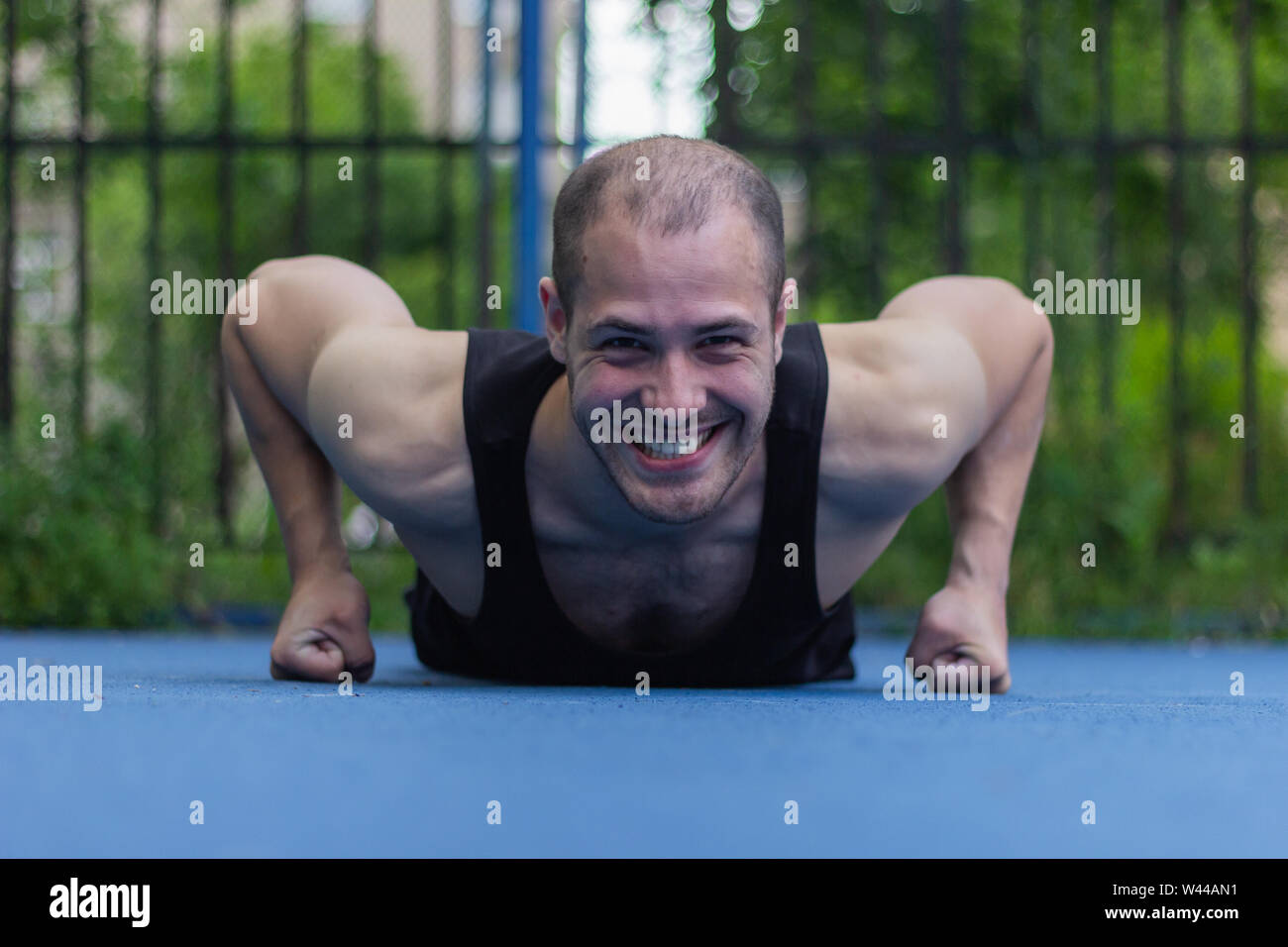 happy athlete doing exercise workout fitness young gym training Stock ...