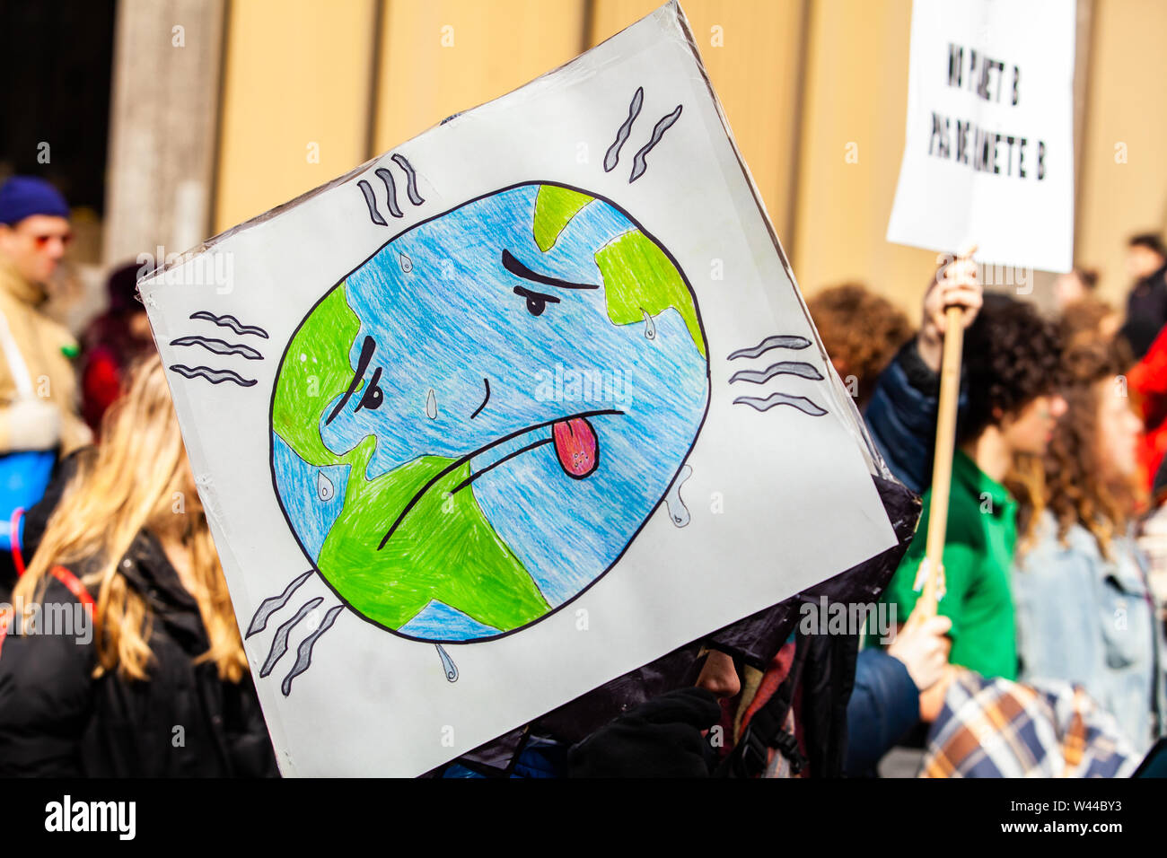A closeup view of a colorful placard, depicting an unwell cartoon ...